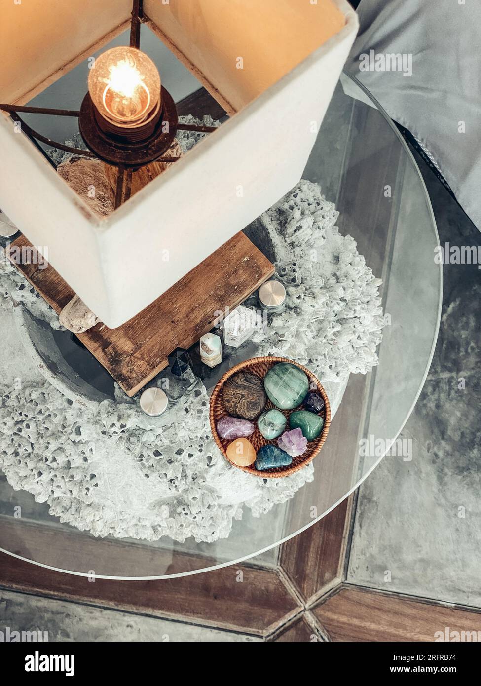 Different healing crystals on glass bedside table top view Stock Photo ...