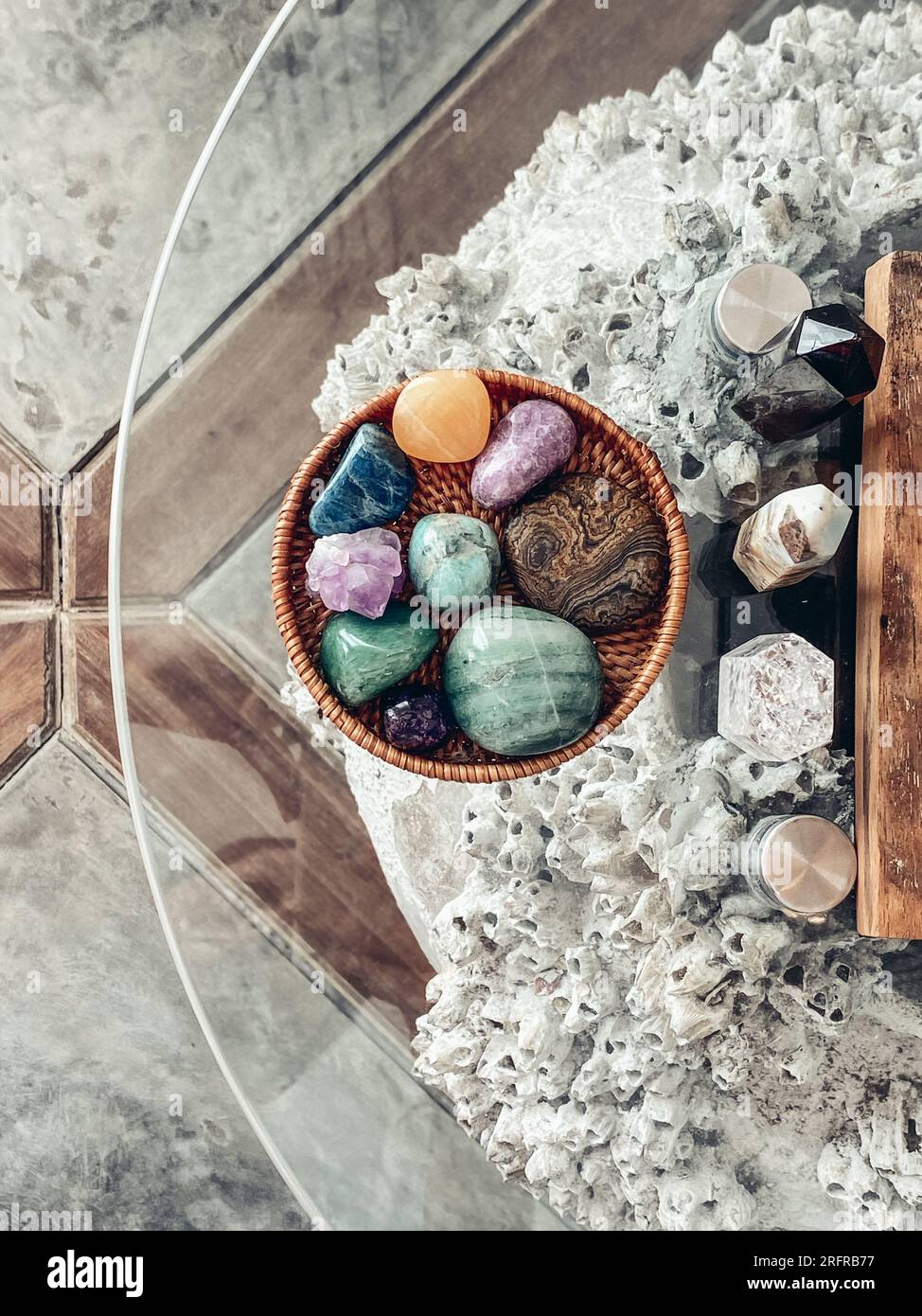 Different healing crystals on glass bedside table top view Stock Photo ...