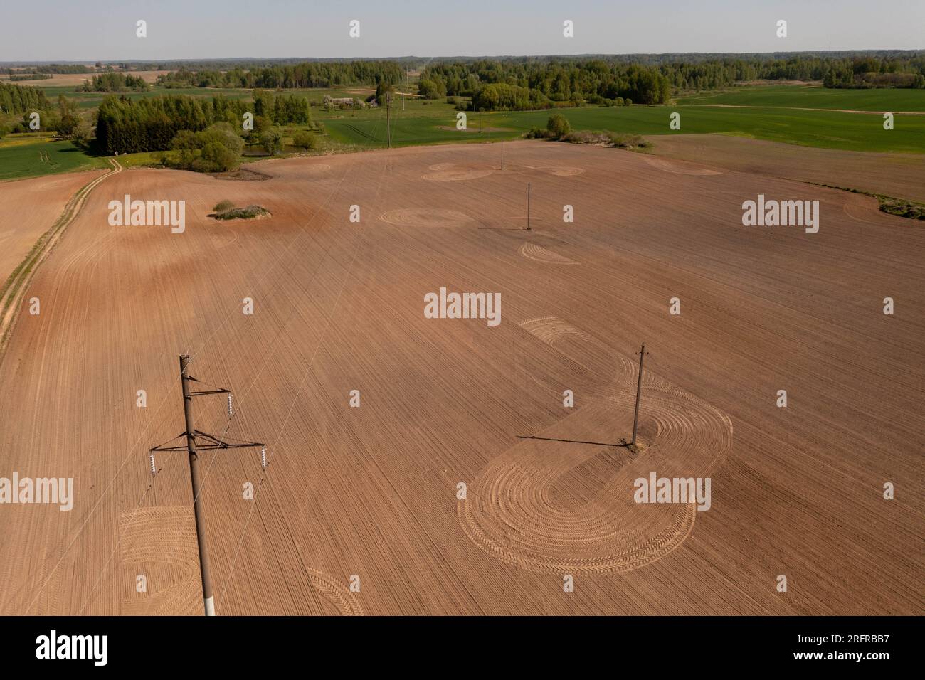 Drone photography of agriculture fields and electricity poles and lines ...