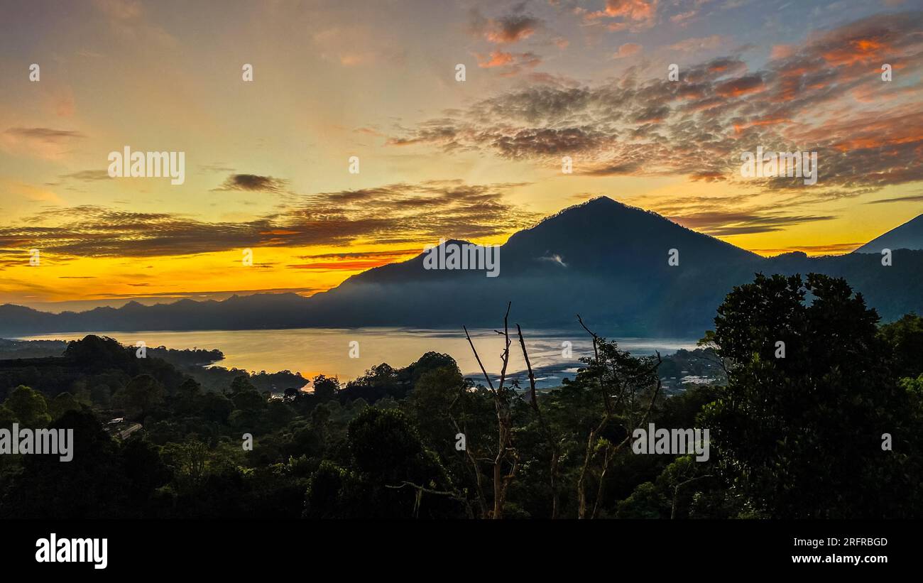 Stunning view on mount Abang and lake Batur at sunrise in Kintamani ...