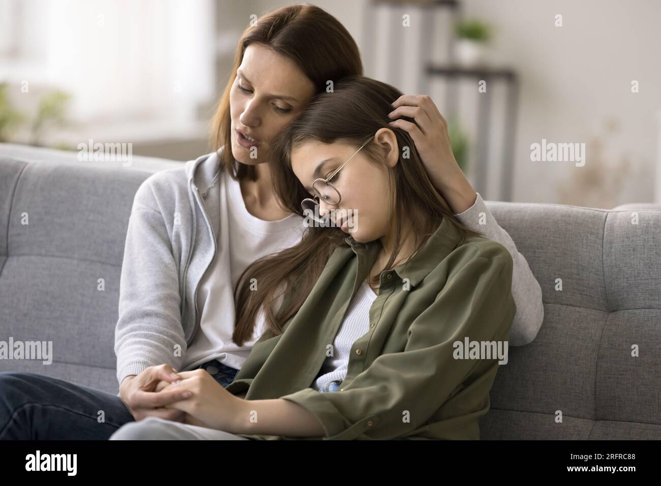 Mom comforting teen daughter hi-res stock photography and images - Alamy