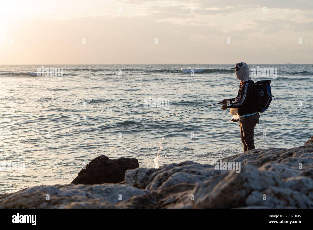 Silhouette fisher on seaside hi-res stock photography and images - Alamy