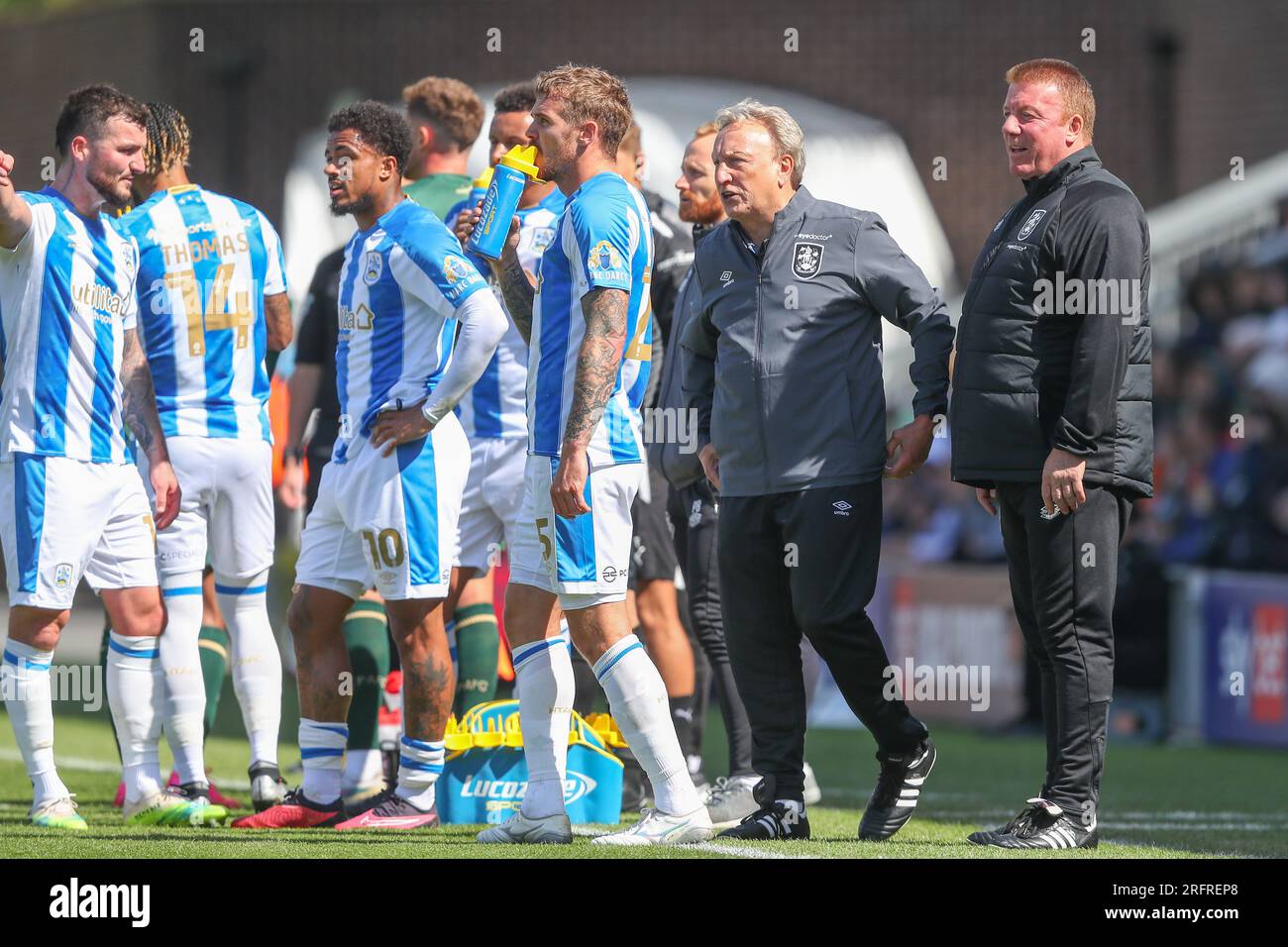 Neil Warnock manager of Huddersfield Town talks with his players during ...