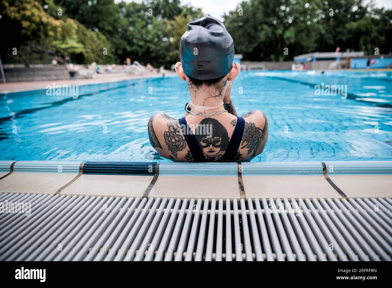 Berlin, Germany. 05th Aug, 2023. A bather pauses at the edge of the ...