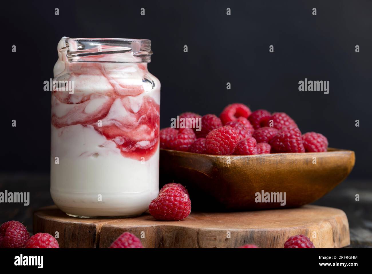 Fresh delicious milk yogurt with raspberry flavor, yogurt with red ...