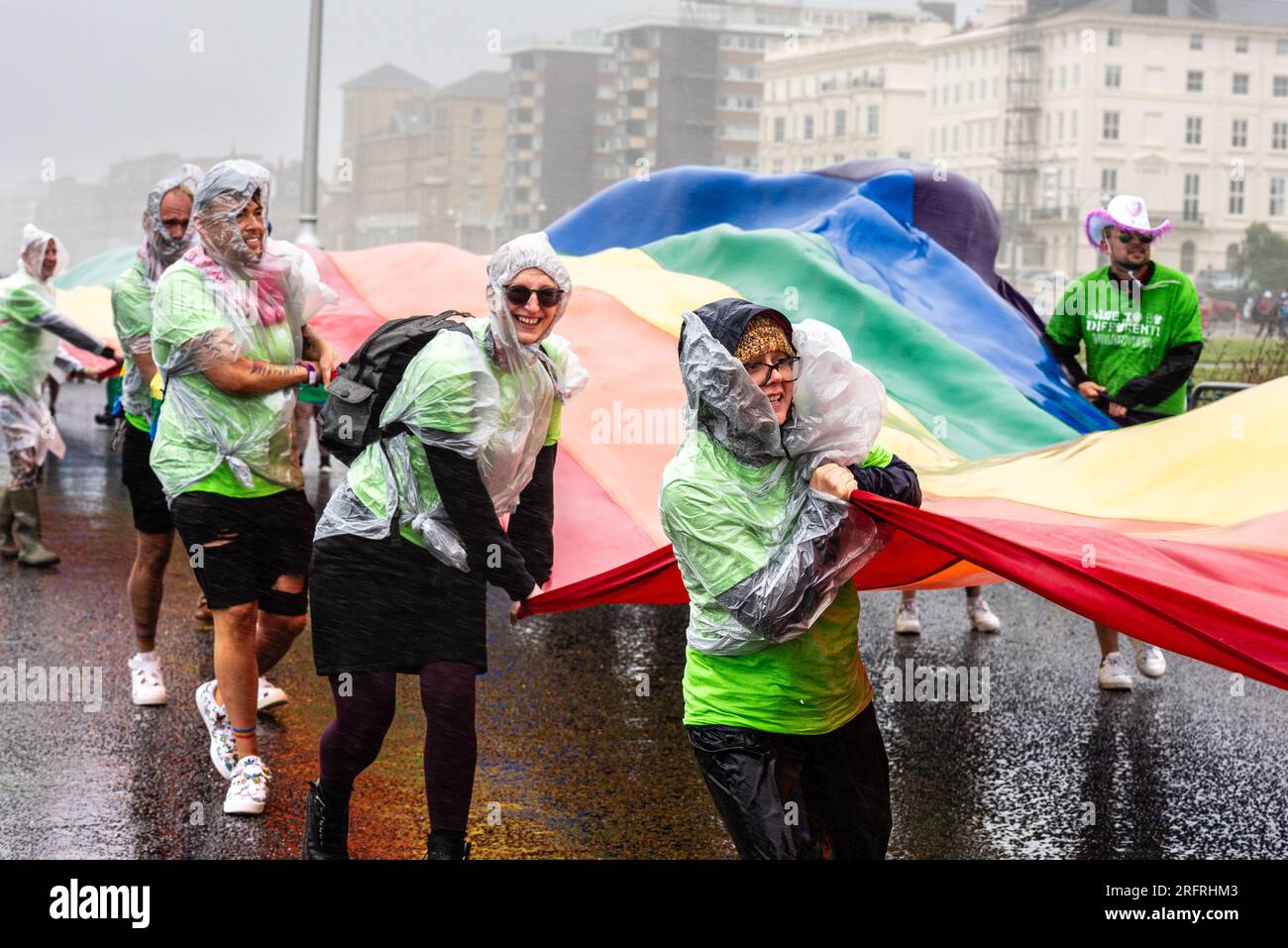 Brighton,UK. 5th August 2023. Keeping the Pride Banner under control ...
