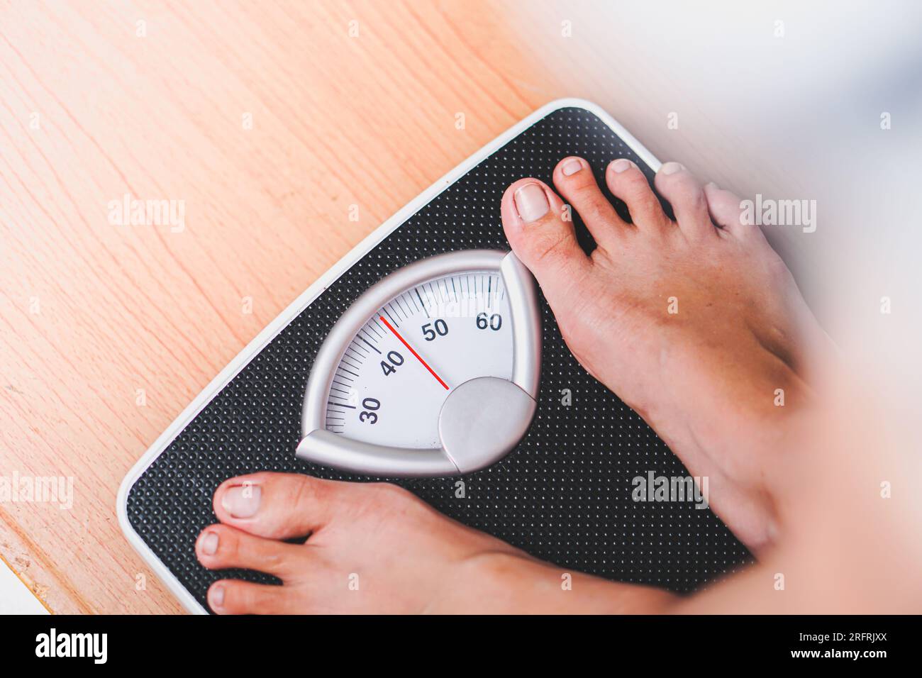 Weighing scale feet hi-res stock photography and images - Alamy