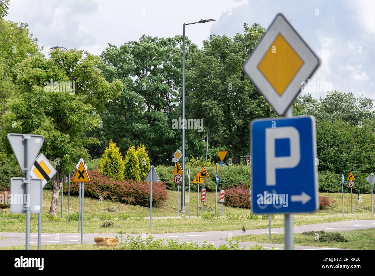 Street with road Signs and Traffic Symbols in Poland. Bicycle square ...