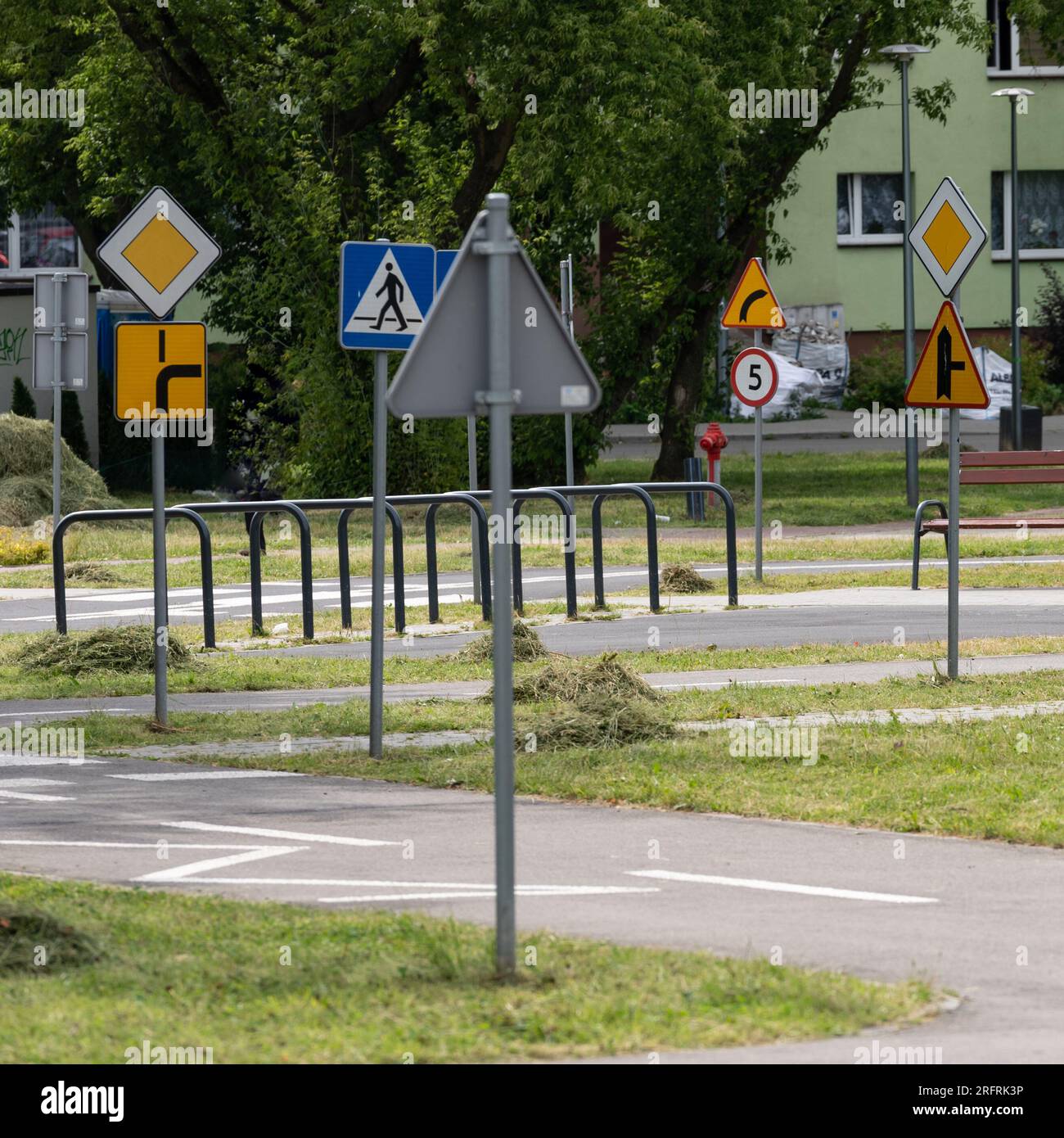 Street with road Signs and Traffic Symbols in Poland. Bicycle square ...