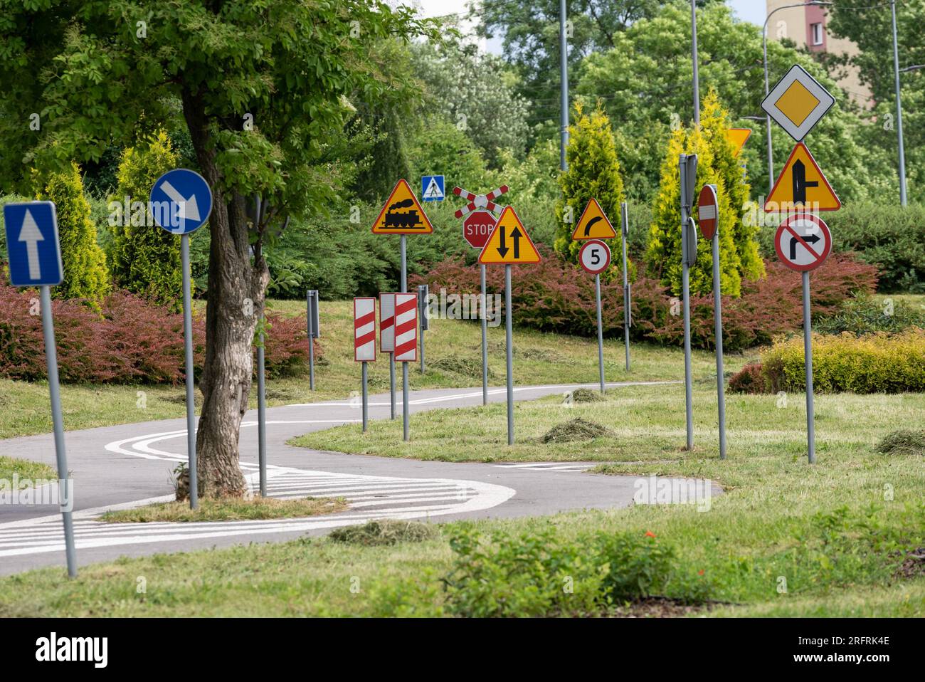 Street with road Signs and Traffic Symbols in Poland. Bicycle square ...