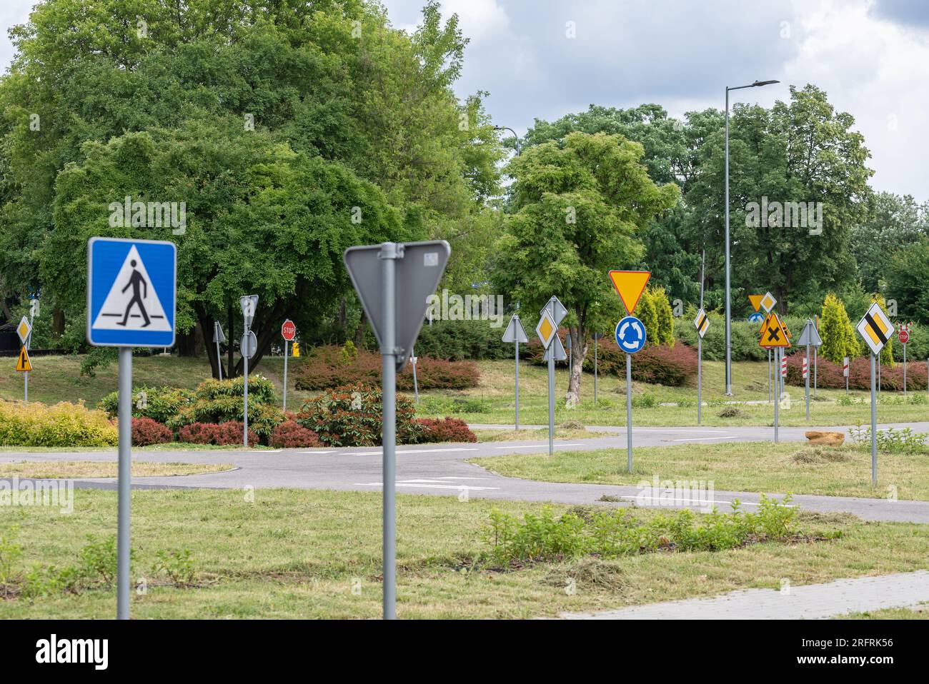 Street with road Signs and Traffic Symbols in Poland. Bicycle square ...