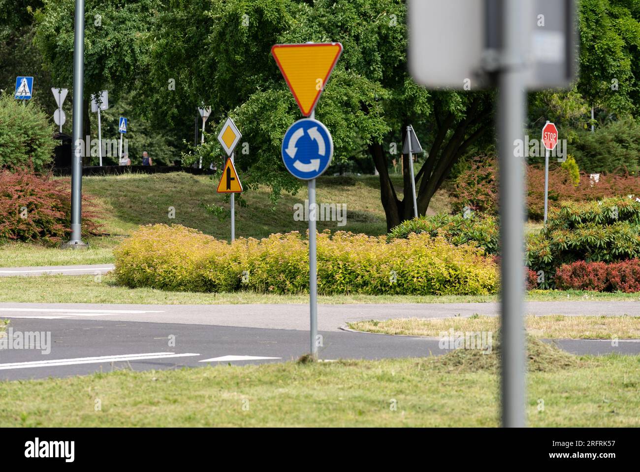 Street with road Signs and Traffic Symbols in Poland. Bicycle square ...