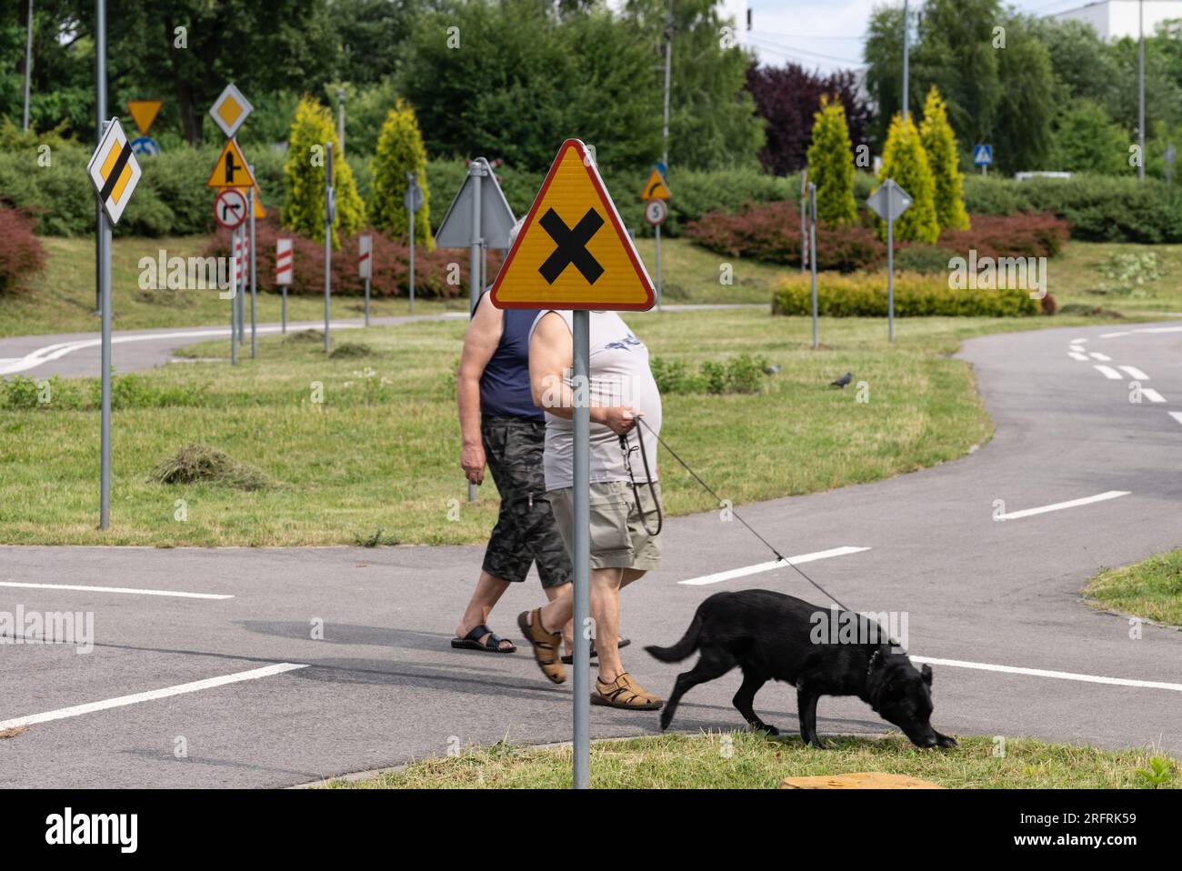 Street with road Signs and Traffic Symbols in Poland. Bicycle square ...