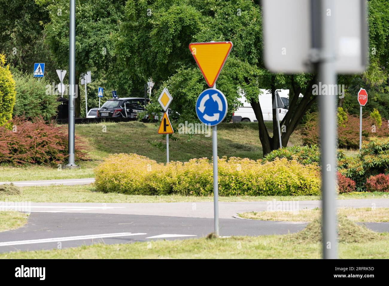 Street with road Signs and Traffic Symbols in Poland. Bicycle square ...