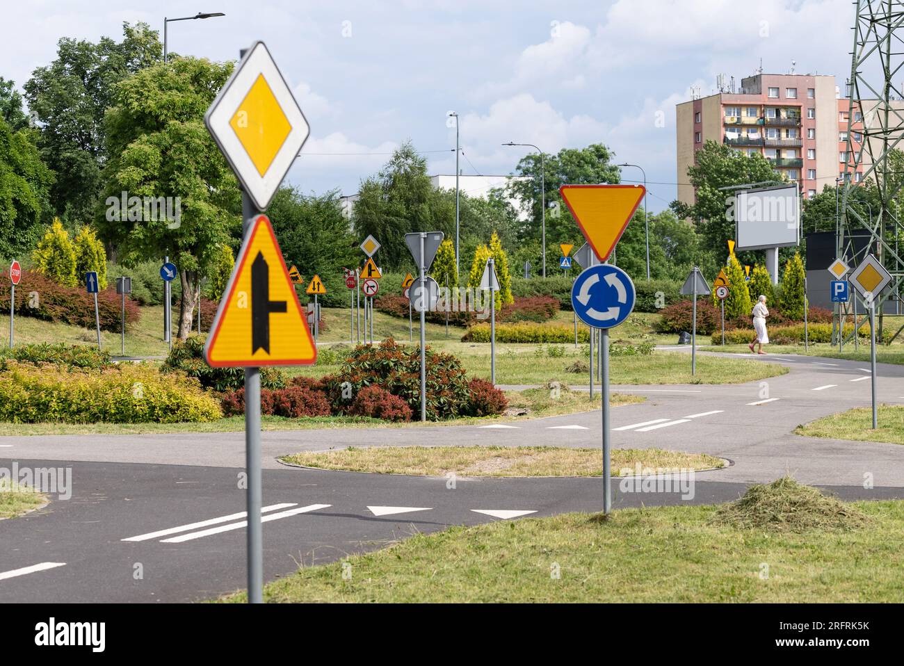 Street with road Signs and Traffic Symbols in Poland. Bicycle square ...