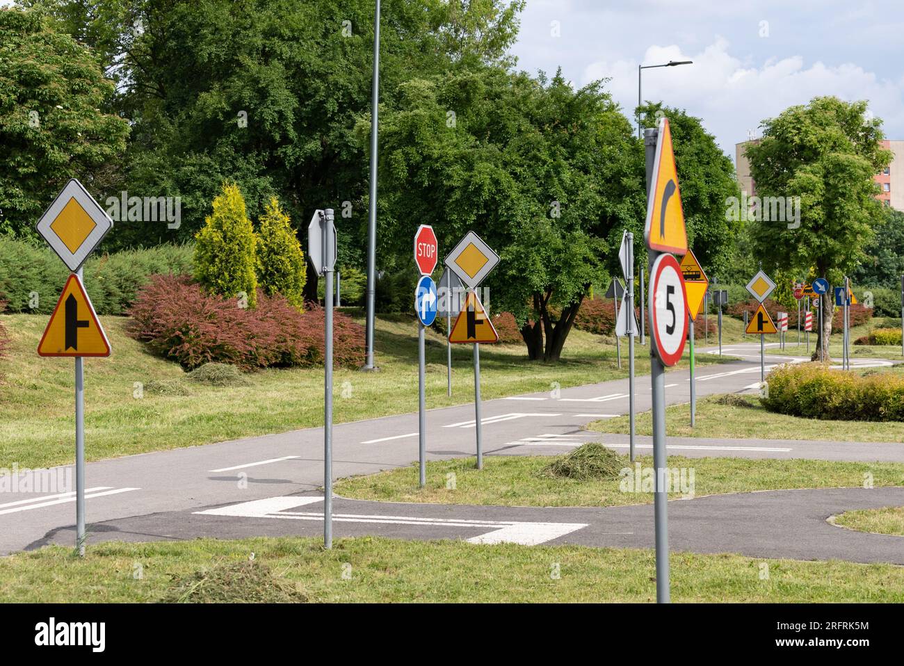 Street with road Signs and Traffic Symbols in Poland. Bicycle square ...