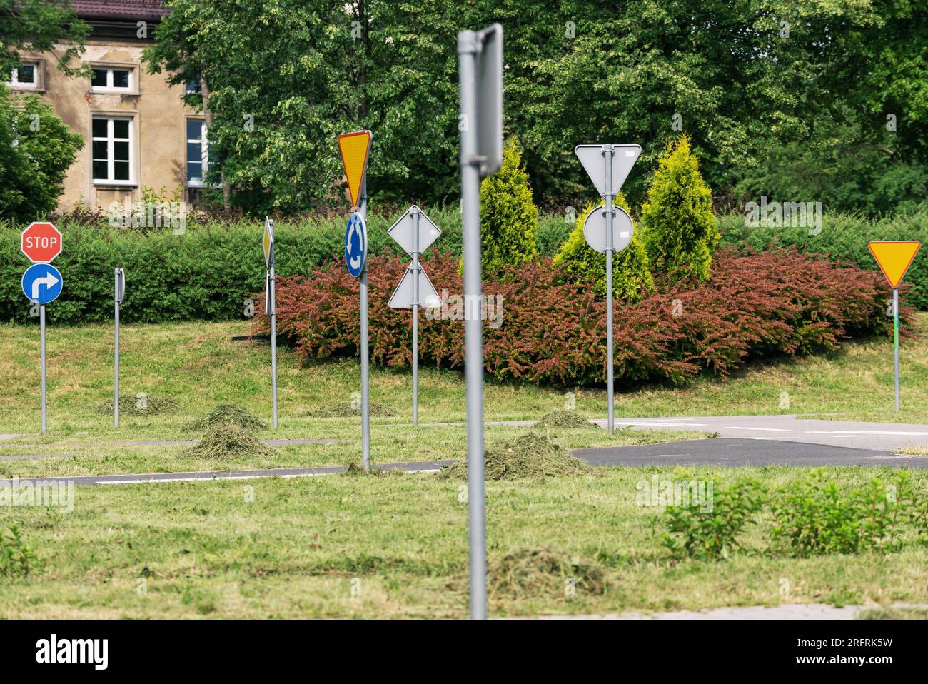 Street with road Signs and Traffic Symbols in Poland. Bicycle square ...