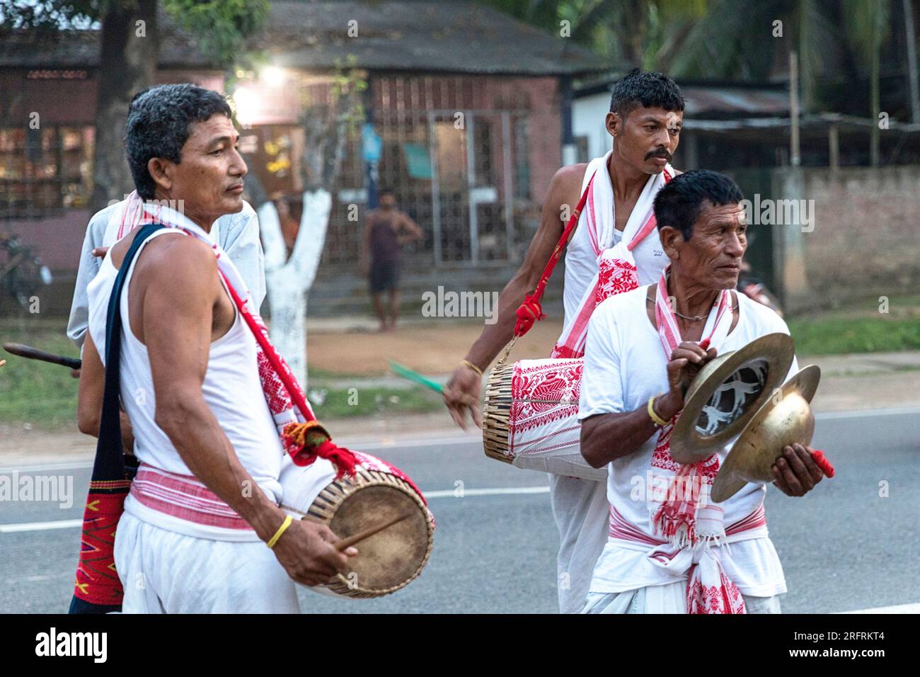 Musicians by the road during the hindu religious ceremony in assam in ...