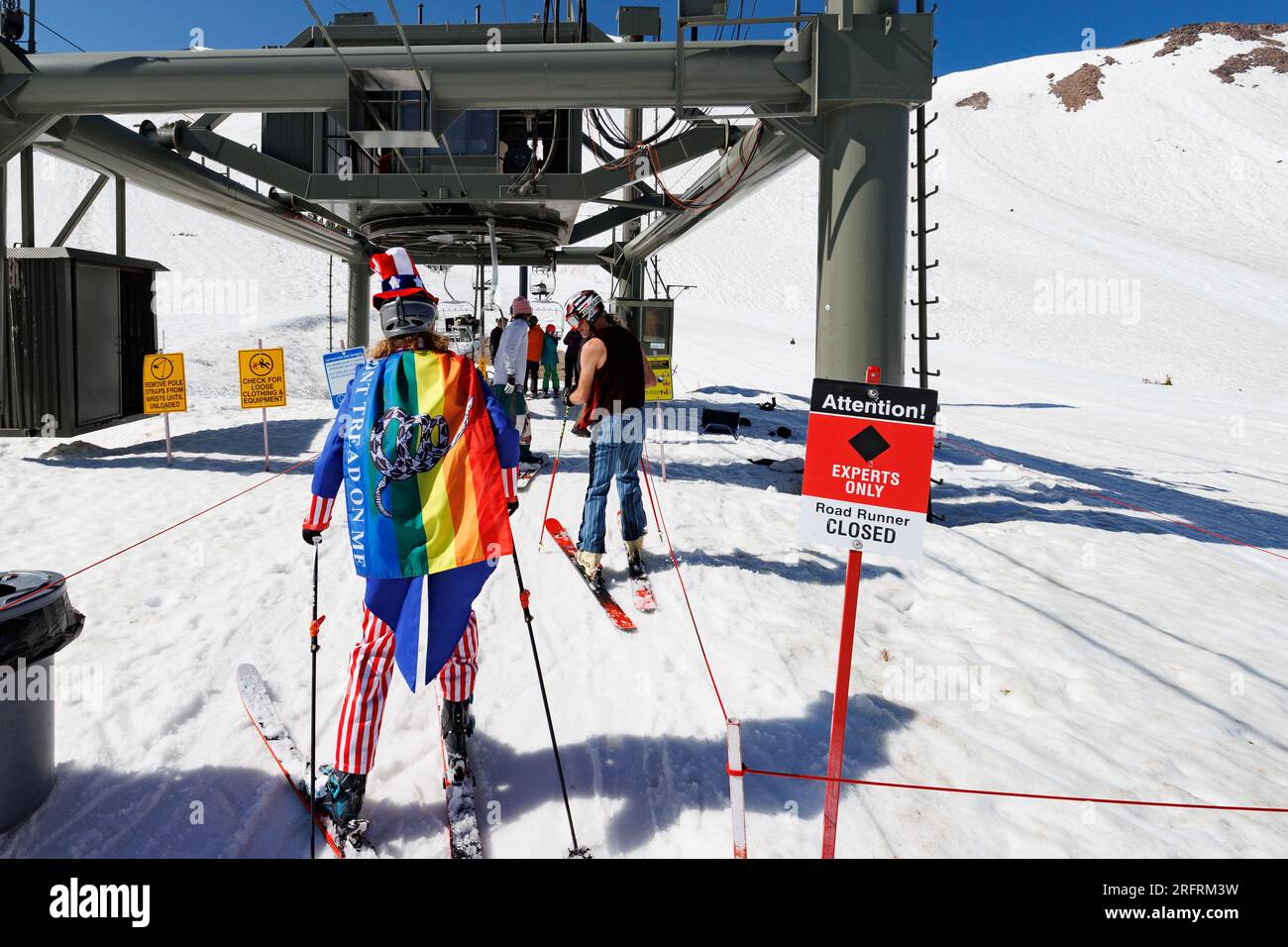 Mammoth Lakes, CA. July 4, 2023. A man with a rainbow pride don't tread ...
