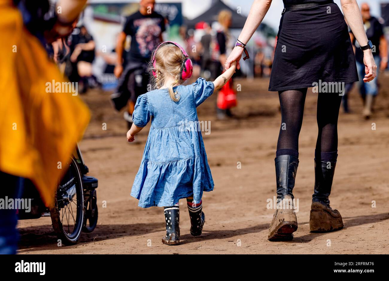 Wacken, Germany. 05th Aug, 2023. A little girl wearing hearing ...