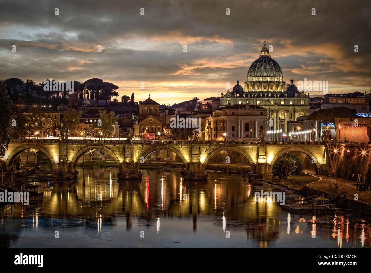 St. Peters Basilica in Vatican City overlooks the Tiber River in Rome ...