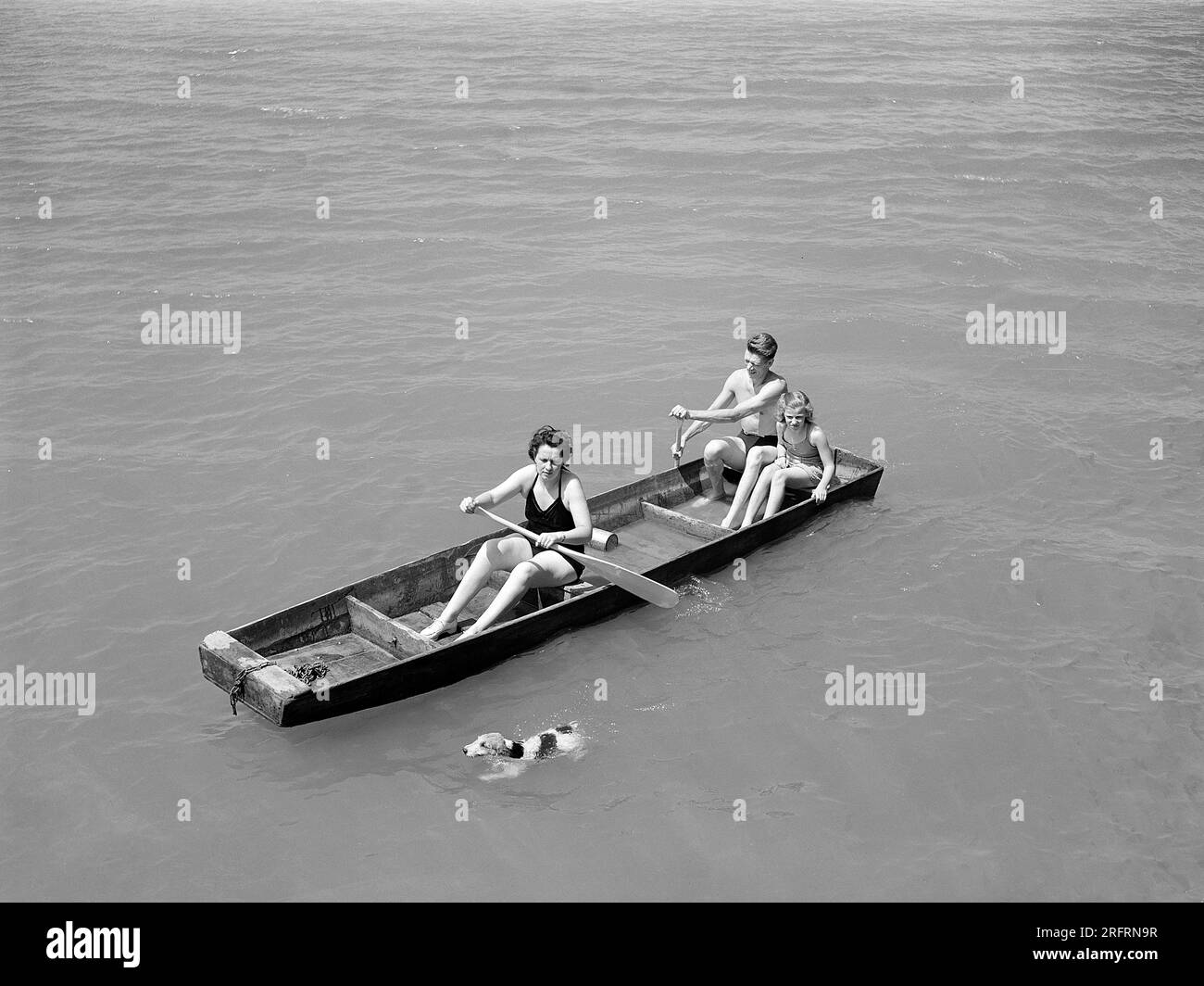Family on row boat Black and White Stock Photos & Images - Alamy