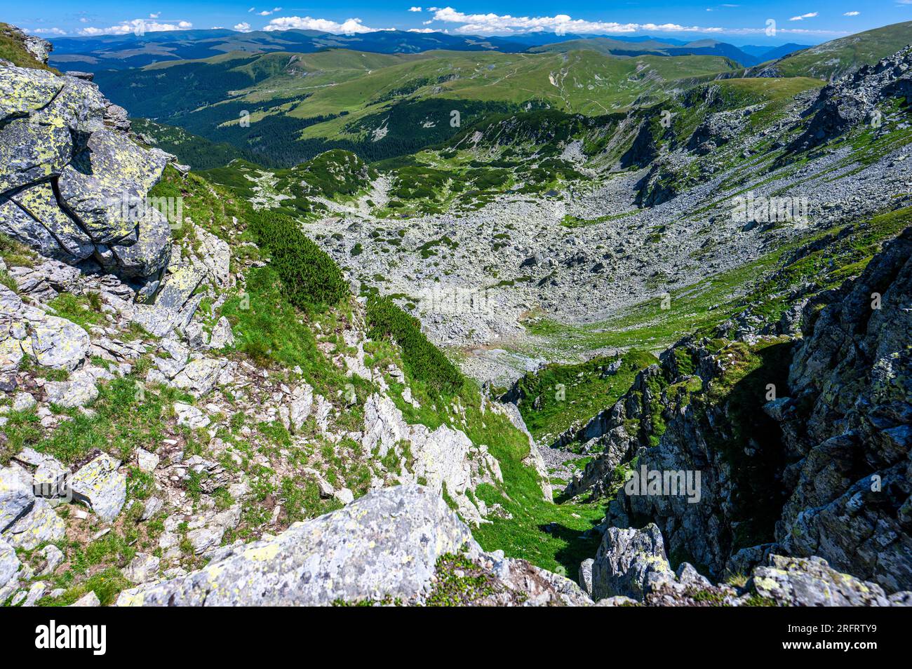 Summer day mountain landscape. Green rocky mountains and a blue sky ...