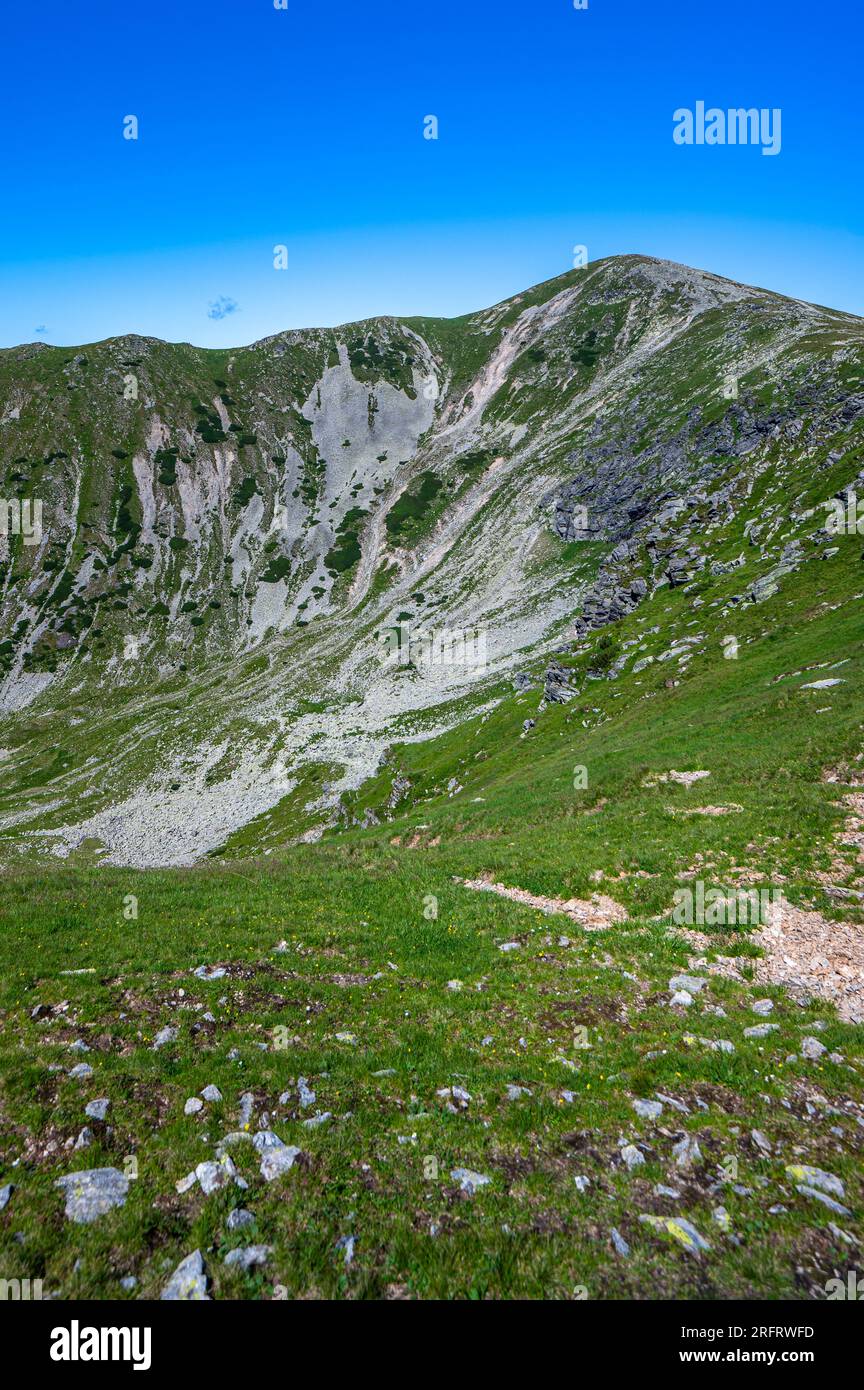 Summer day mountain landscape. Green rocky mountains and a blue sky ...