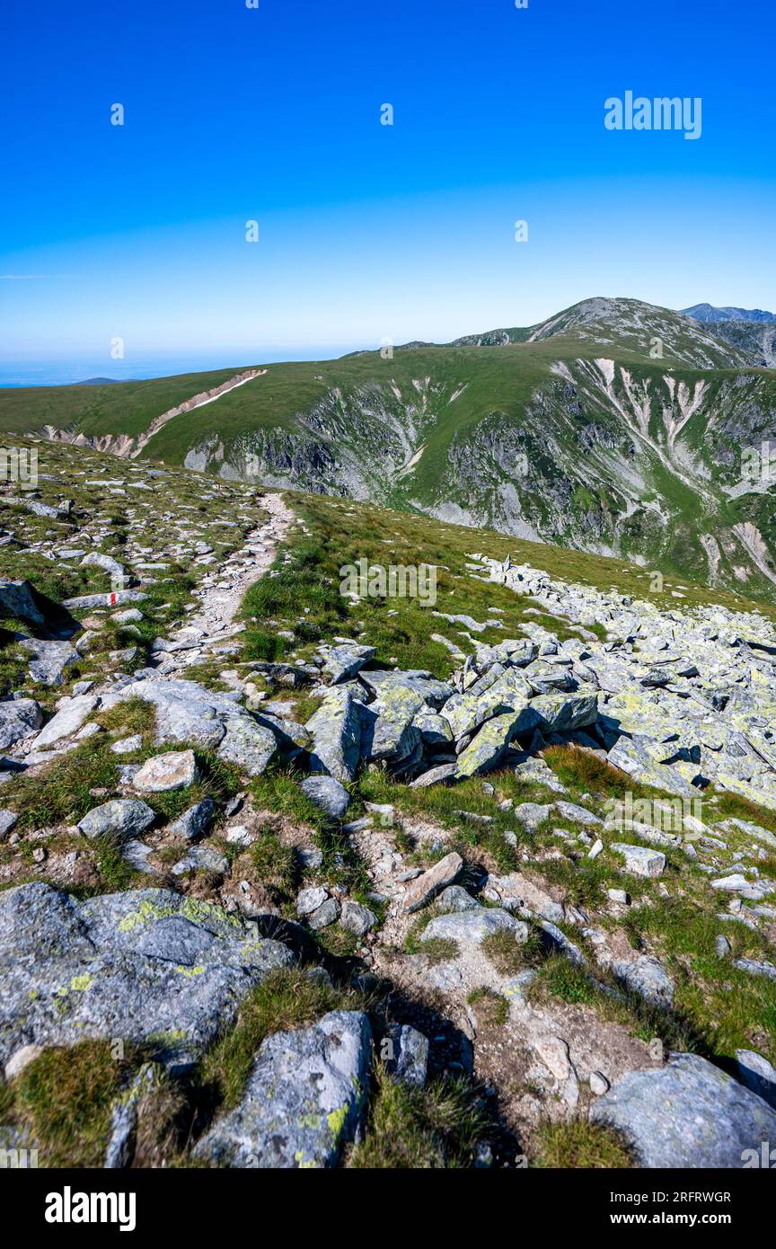 Summer day mountain landscape. Green rocky mountains and a blue sky ...