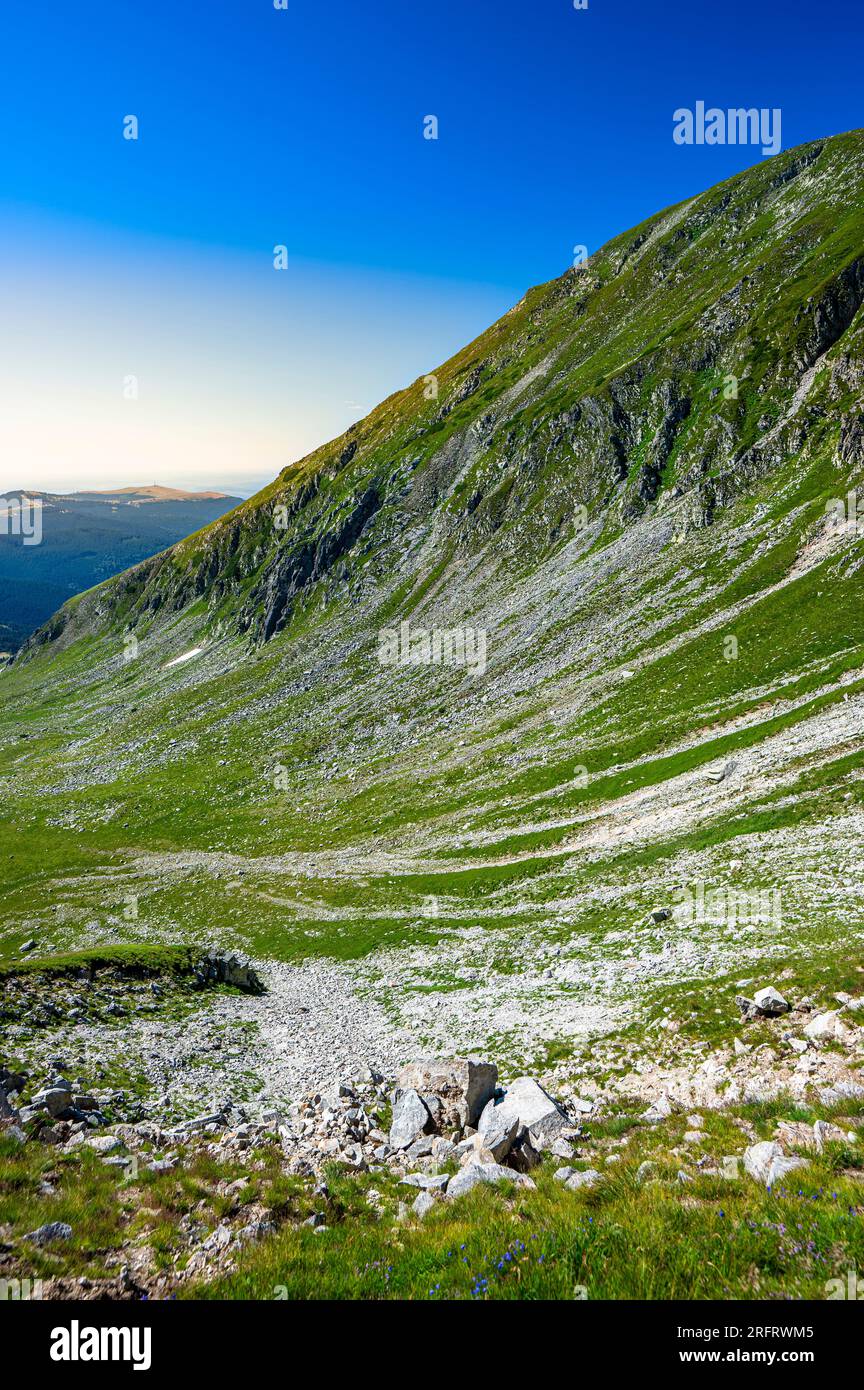 Summer day mountain landscape. Green rocky mountains and a blue sky ...