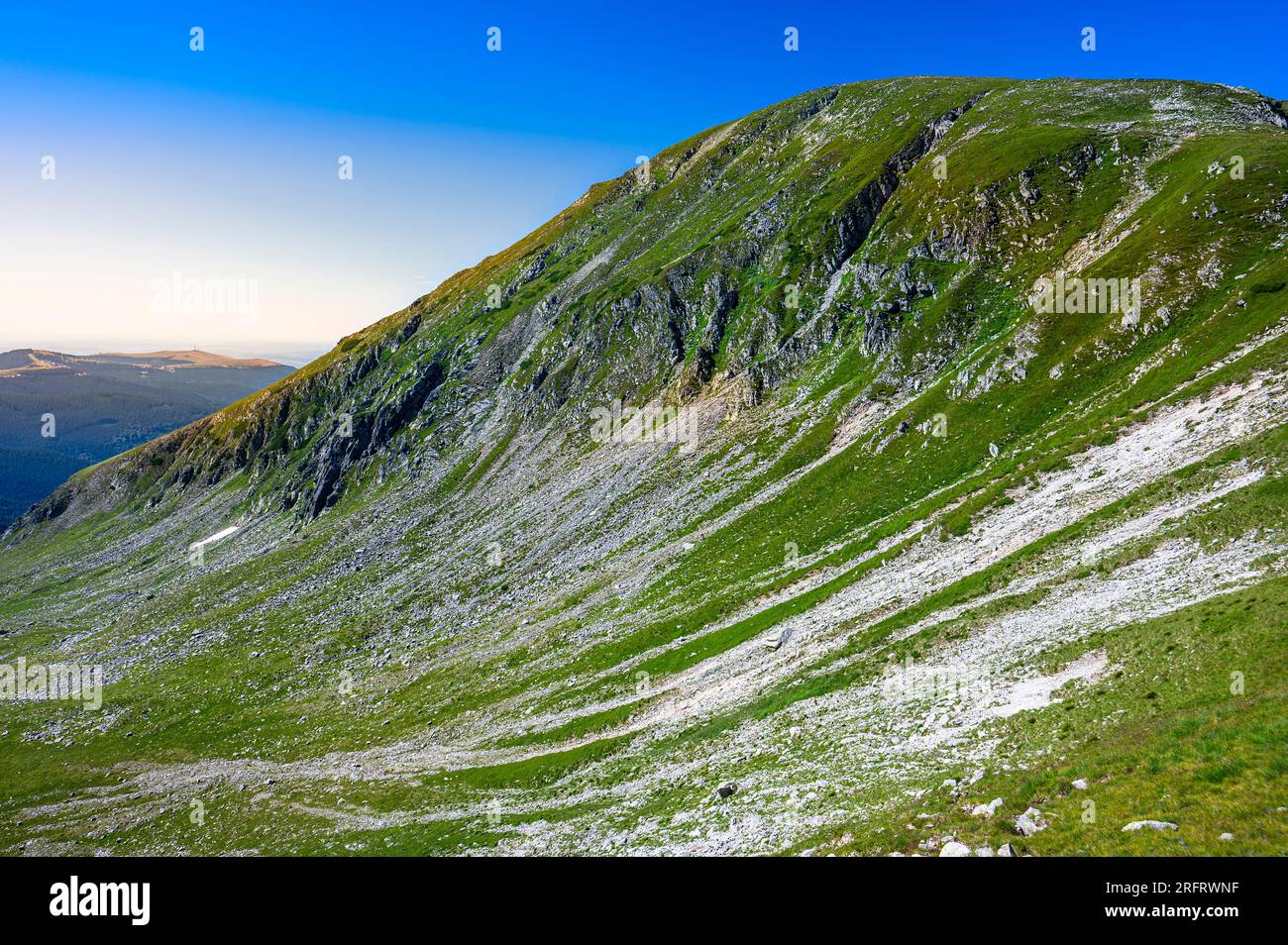 Summer day mountain landscape. Green rocky mountains and a blue sky ...