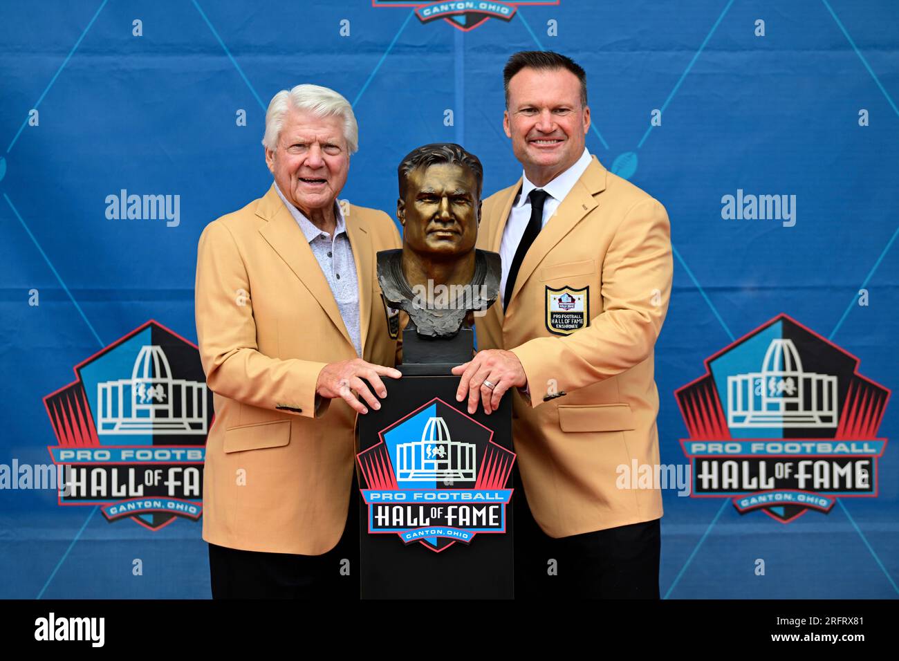 Former NFL player Zach Thomas, right, poses with his former coach Jimmy ...