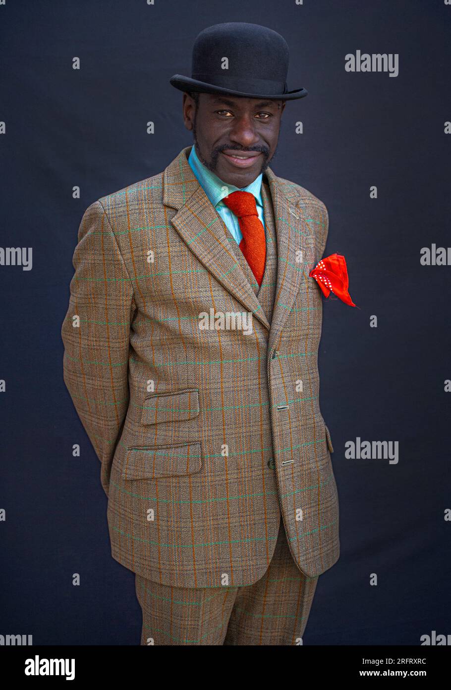 Stylish african man wear suits and bowler hat Stock Photo - Alamy