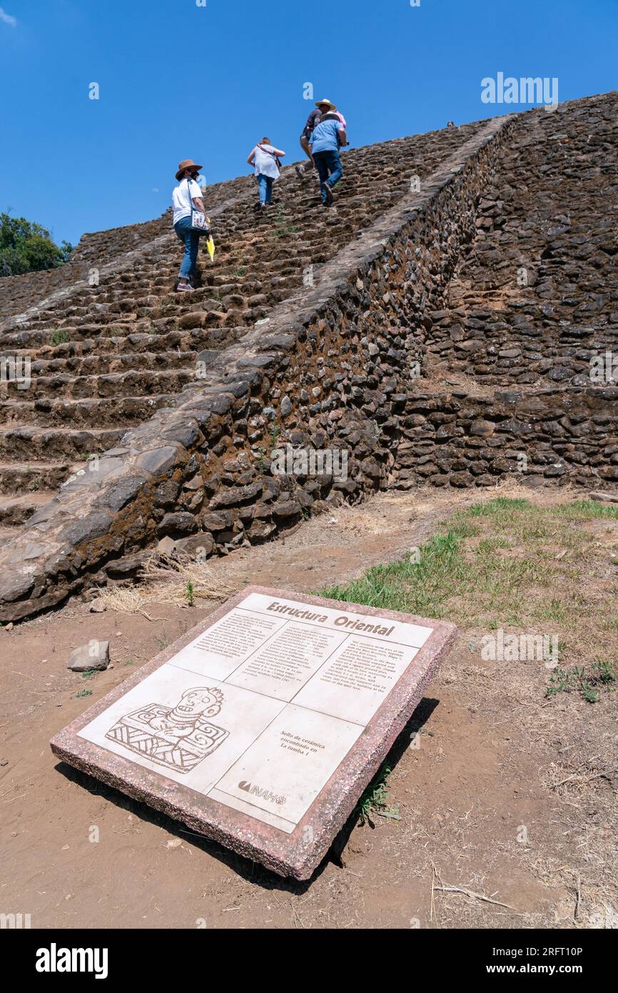 People climb up the steps of the ancient seven layer pyramid in the ...