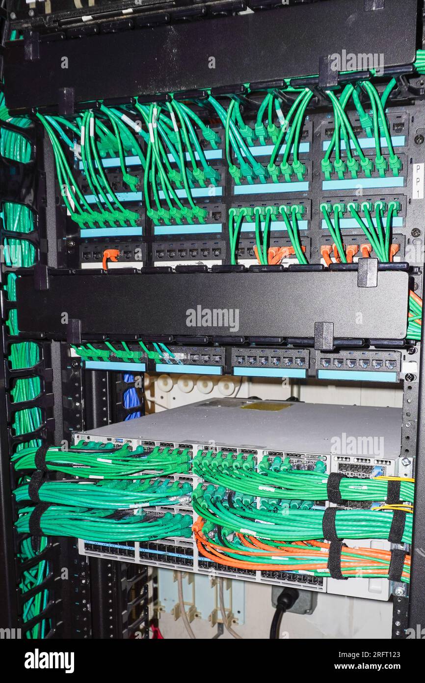 Photo of IT equipment and patch cables in a surver room Stock Photo - Alamy