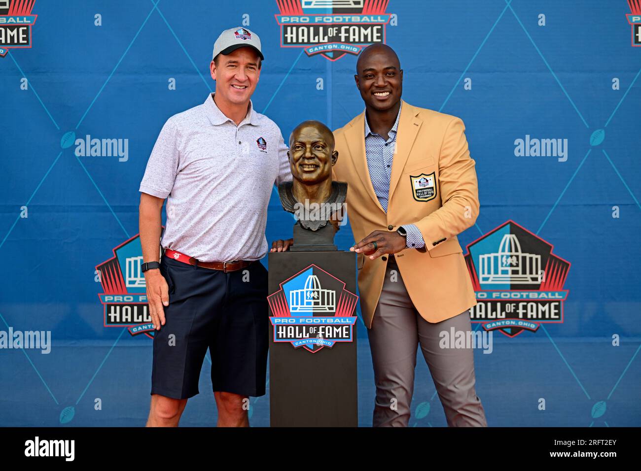 Former NFL players DeMarcus Ware, right, and Peyton Manning pose with ...