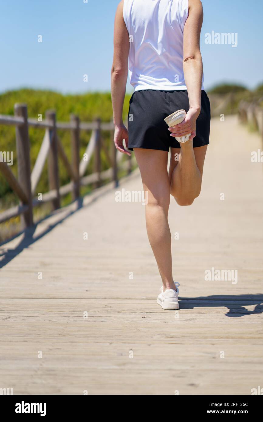 Woman stand one leg raised hi-res stock photography and images - Alamy
