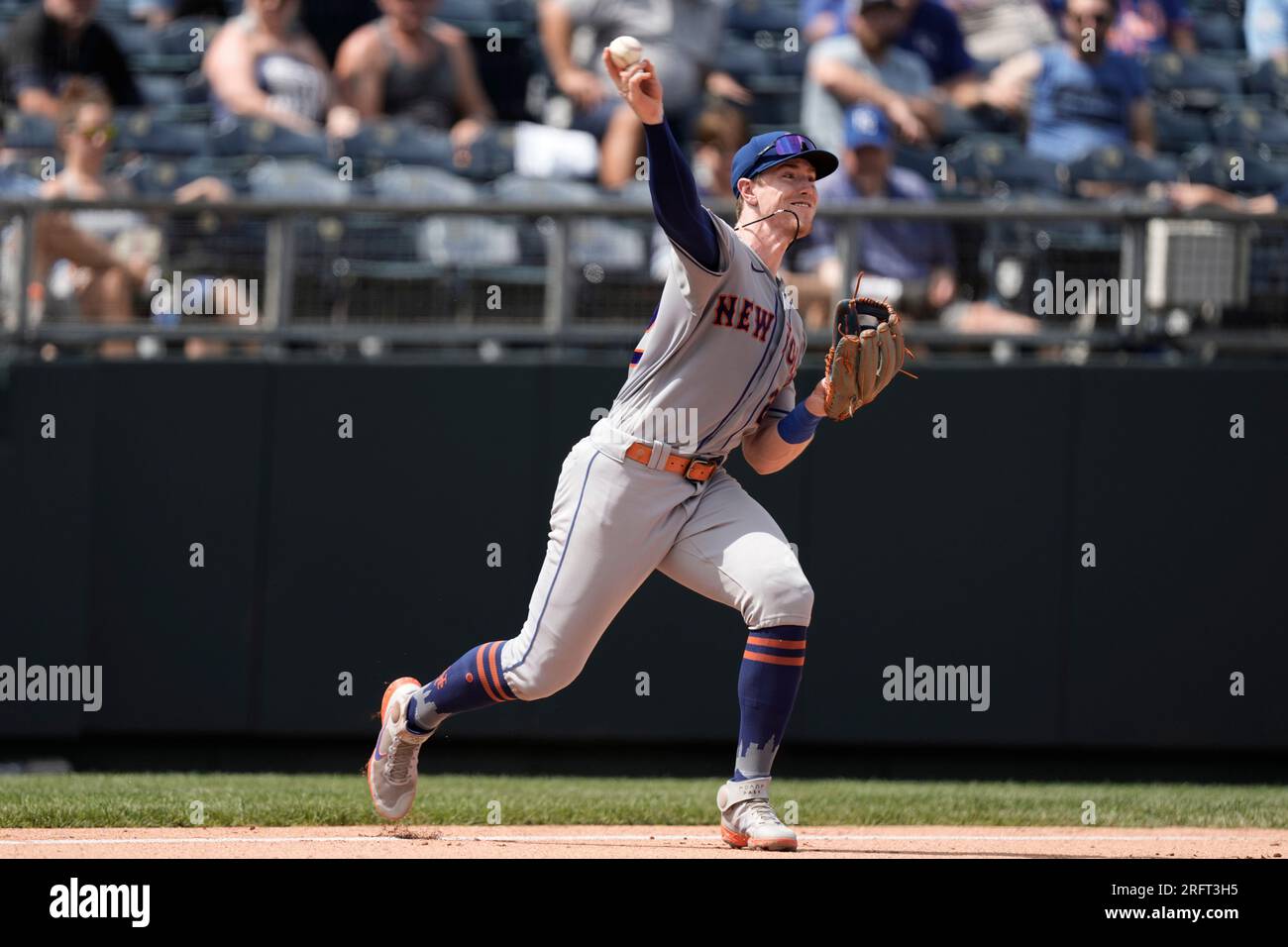 New York Mets third baseman Brett Baty throws to first during the eighth inning of a baseball ...