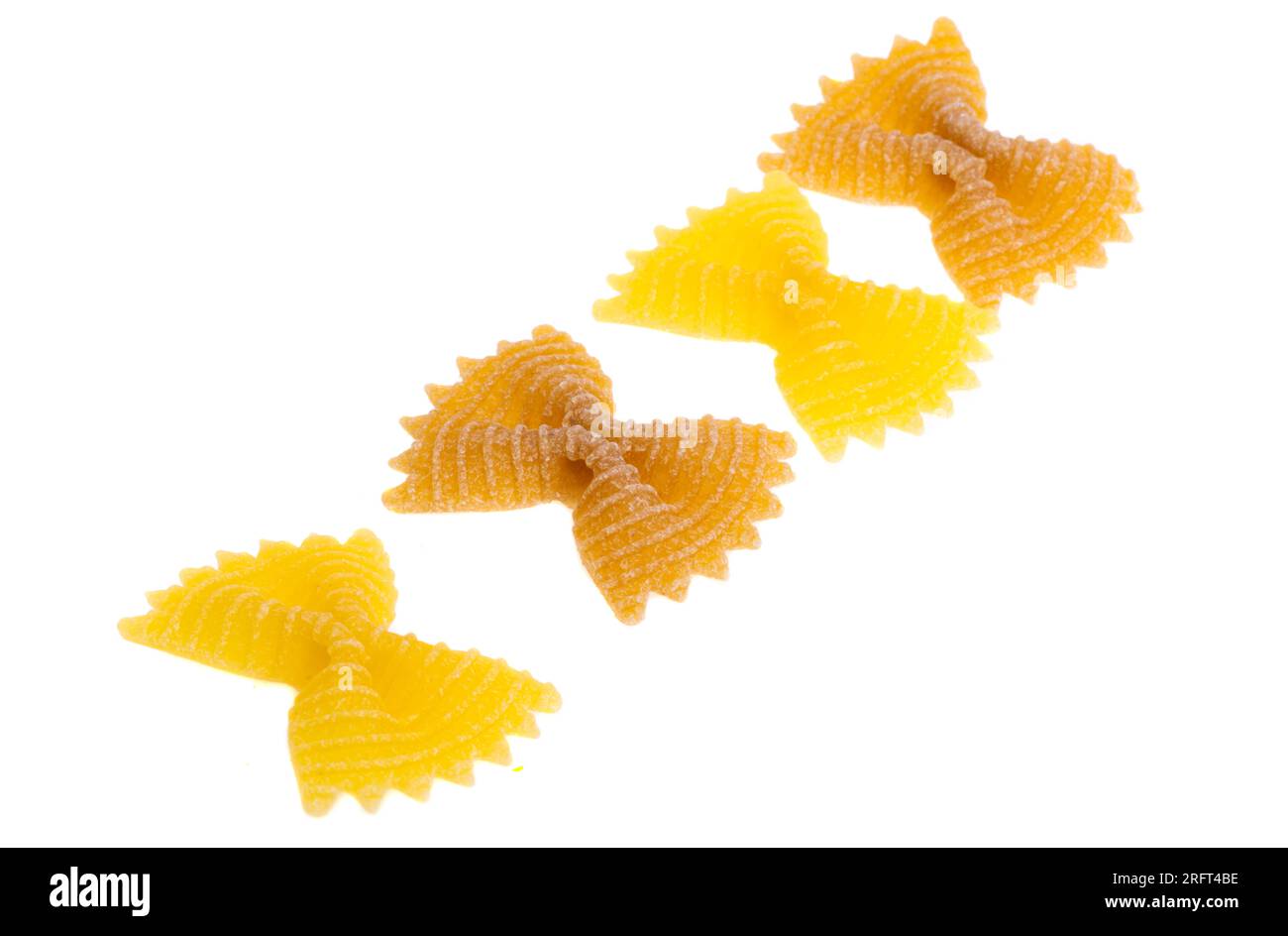 pasta bows isolated on white background Stock Photo - Alamy