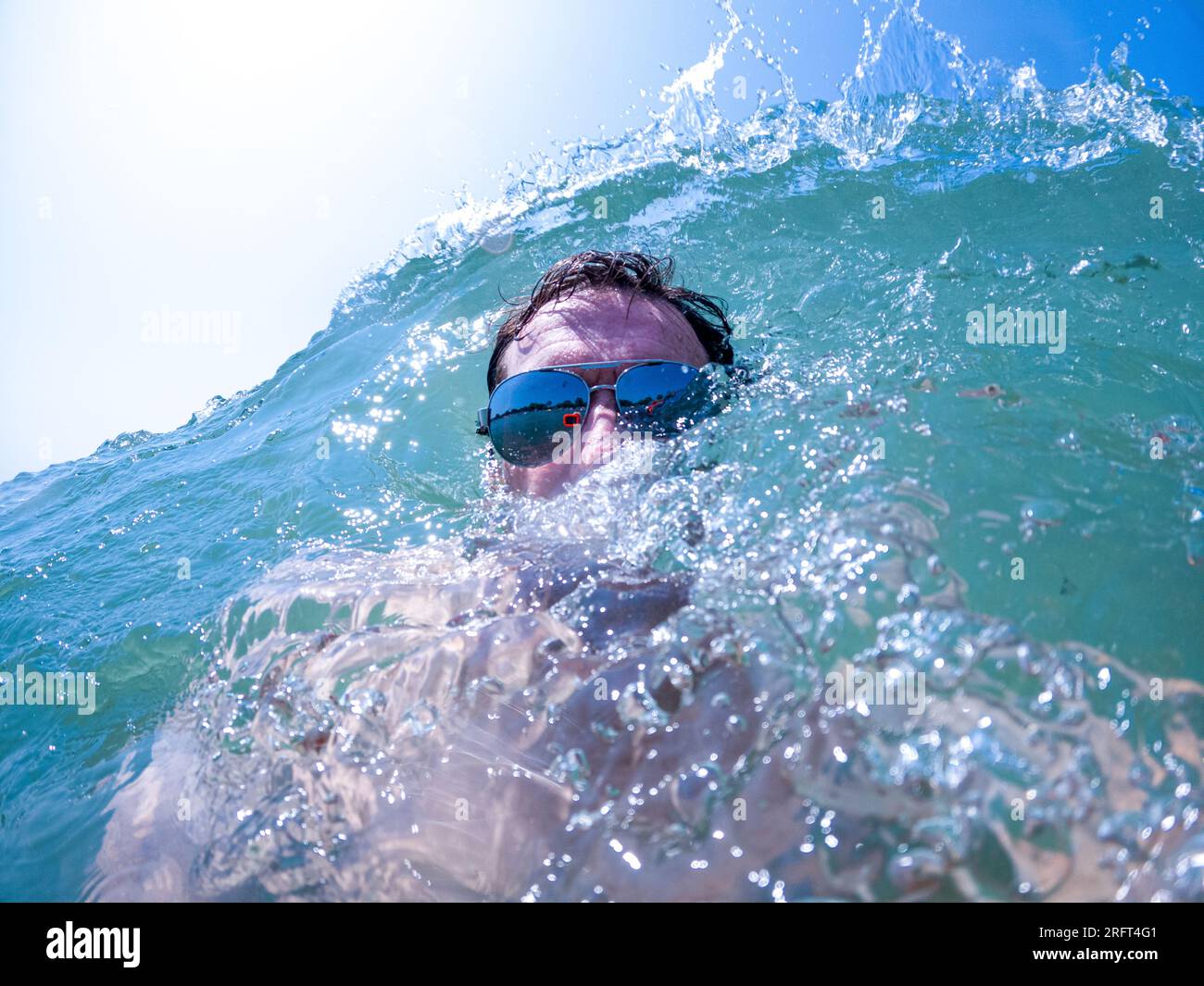 Man submerged in wave hi-res stock photography and images - Alamy