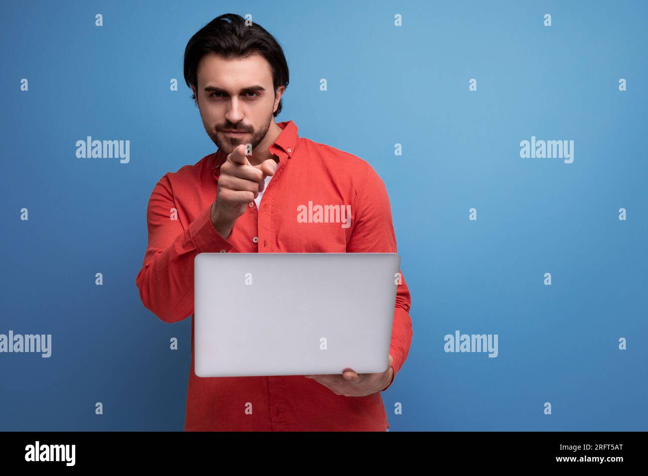 smart european young guy with chic black hair with laptop Stock Photo ...
