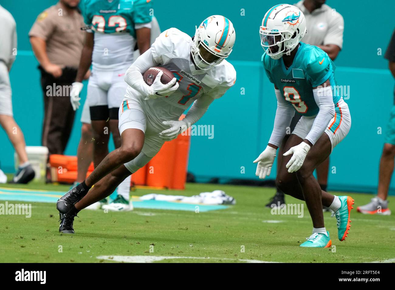 Miami Dolphins wide receiver Cedrick Wilson Jr., left, runs with the ...