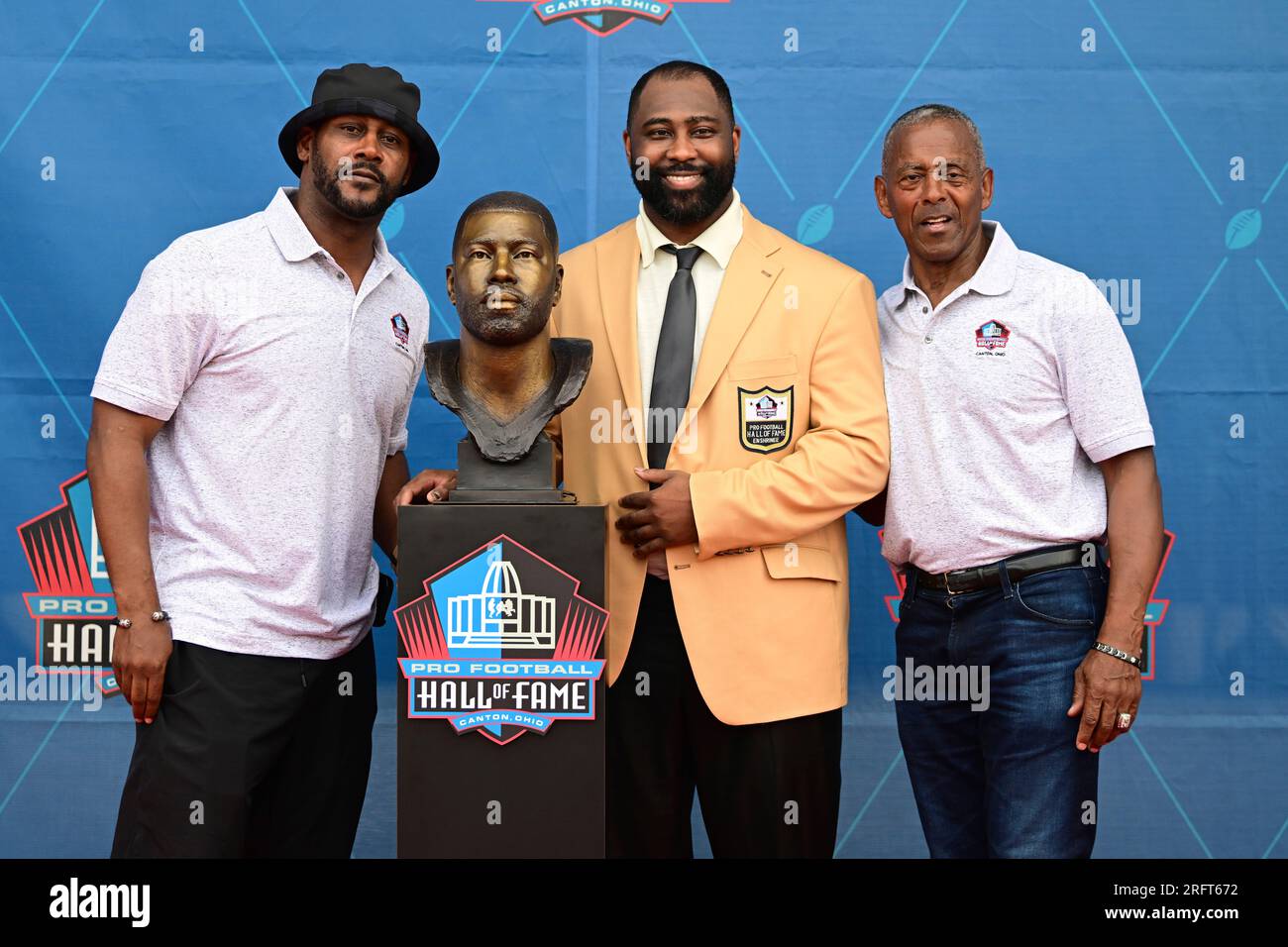 Former NFL players Darrelle Revis, second from right, poses with Tony ...