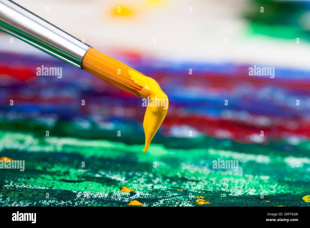 the creative process of drawing by mixing different colors of paints ...