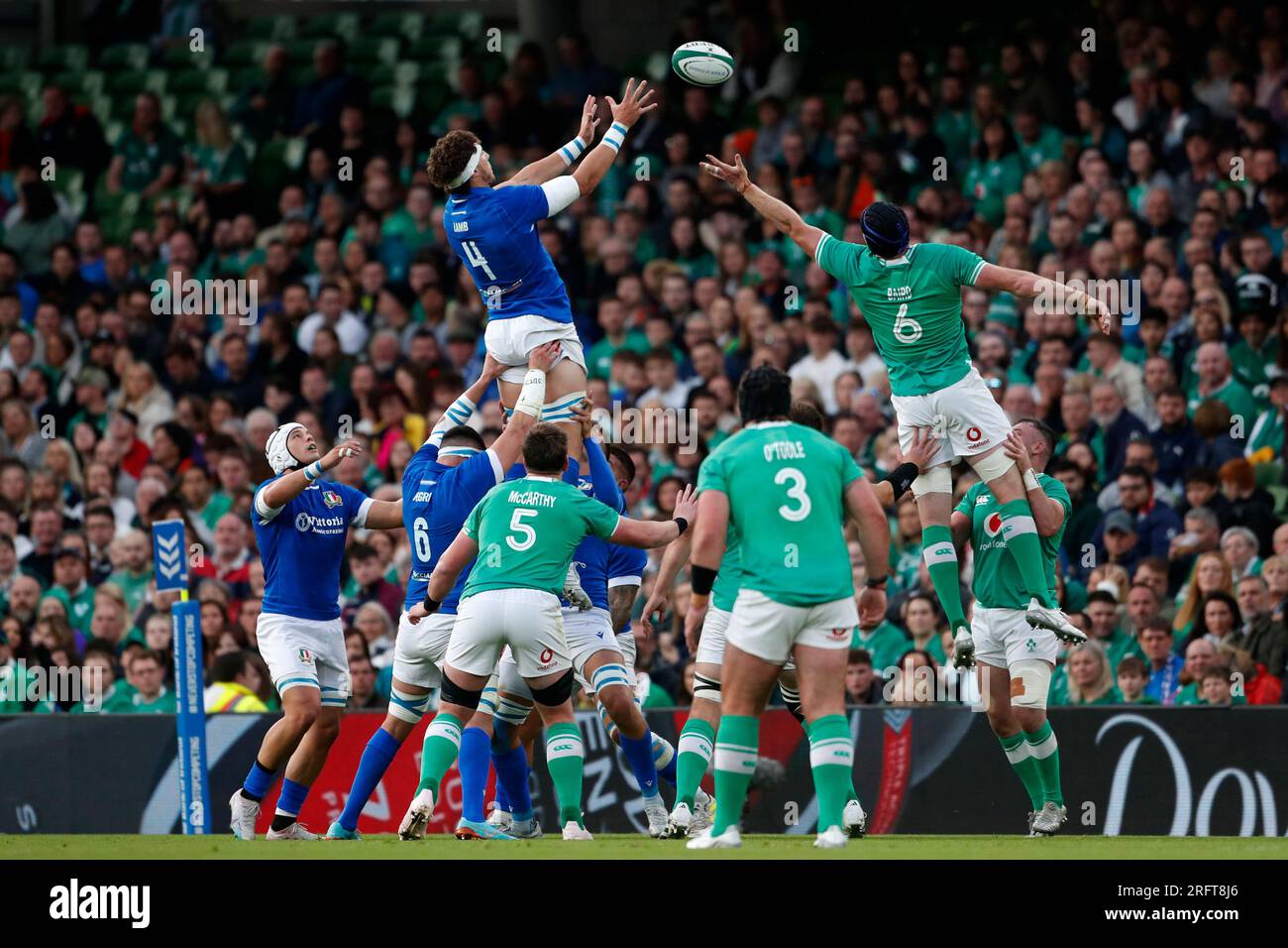 Italy's Dino Lamb, top left, catches the ball against Ireland's Ryan ...