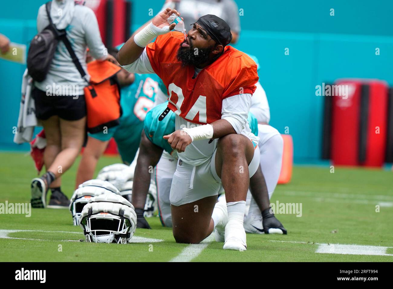 Miami Dolphins defensive tackle Christian Wilkins drinks water during a ...