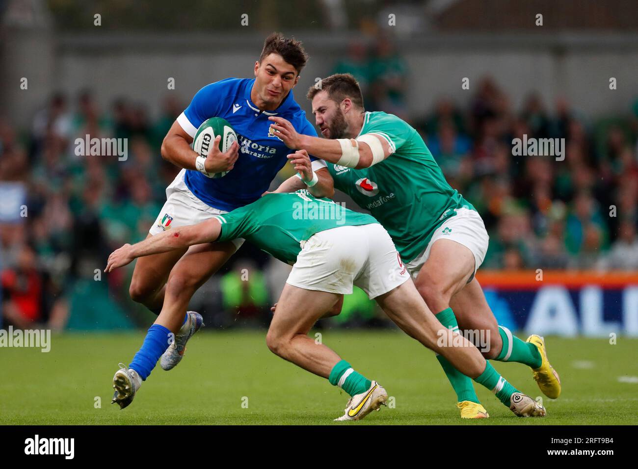 Italy's Lorenzo Pani, left, is tackled by Ireland's Jimmy O'Brien ...