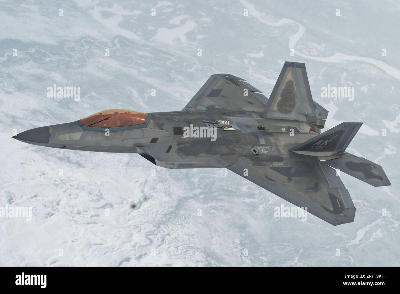 An F-22 Raptor flies over the Alaskan Range during exercise Northern ...