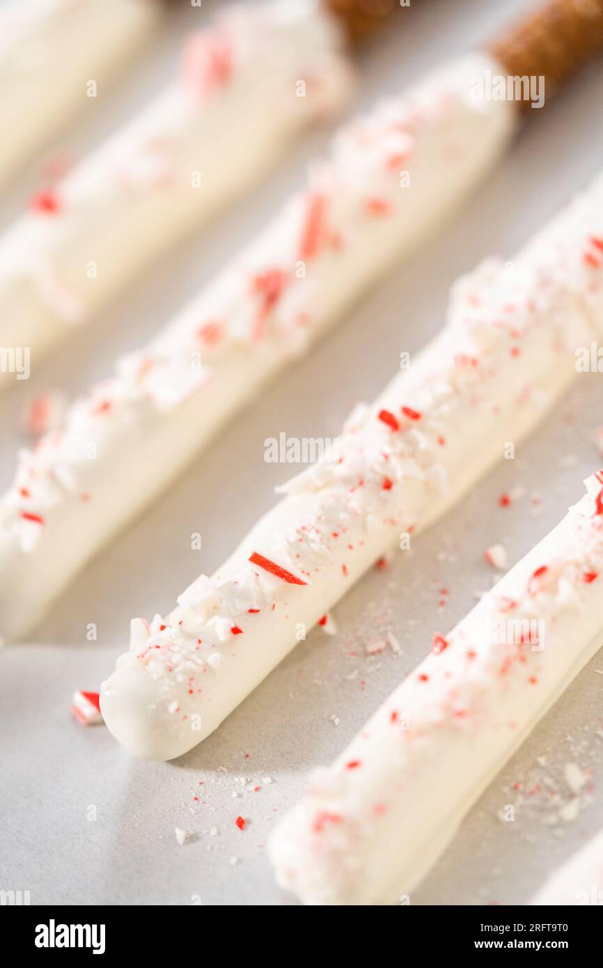 Candy cane chocolate covered pretzel rods Stock Photo - Alamy