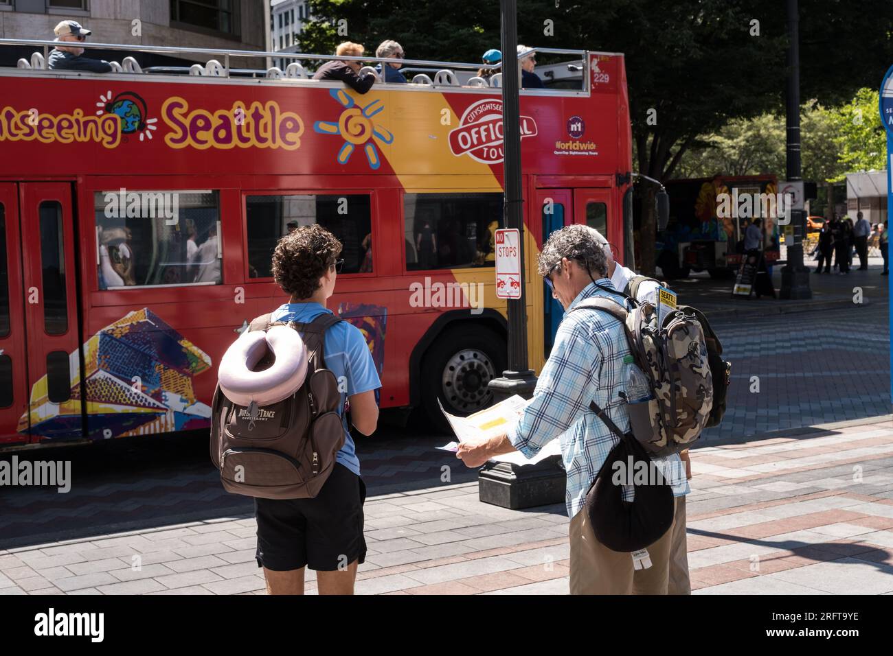 Red hop on bus passes hi-res stock photography and images - Alamy